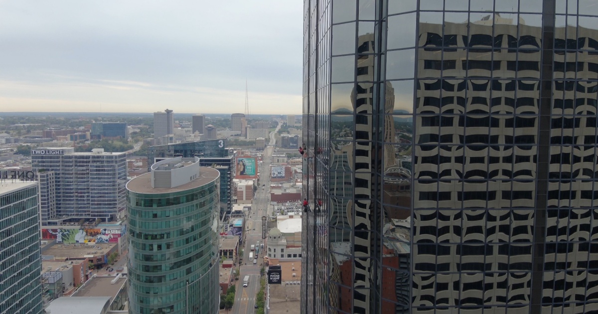 LOOK: Window washer rescued after getting stuck hanging off between ...